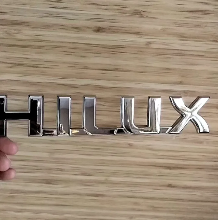 Emblem Logo stiker Lambang Huruf Tulisan Toyota Hilux baru Hilux lama ...