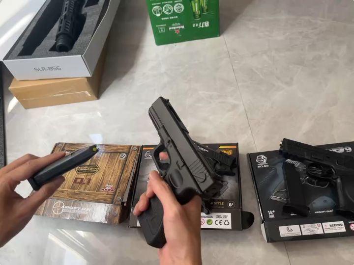 Glock's nylon metal versions of various styles hang hand-in-hand guns ...