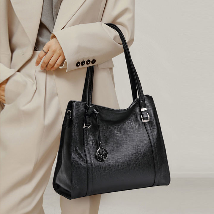 The new leather women's bag has a large capacity hand-carried bag with ...