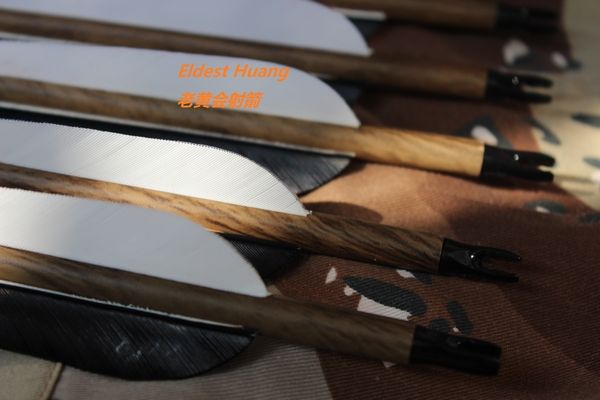 The traditional arrow with heavy wood grain and carbon strength is used ...