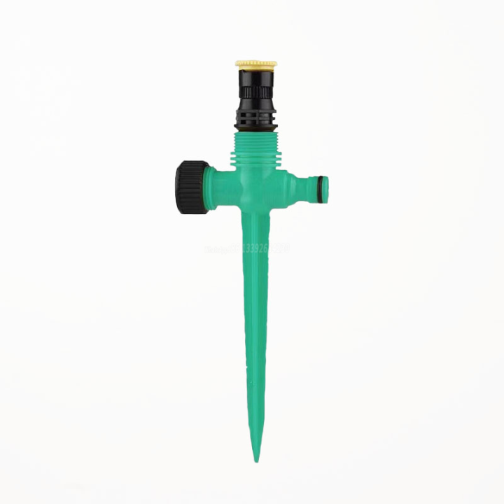 Fixed sprinkler head with wire and ground needle inserted into the ...