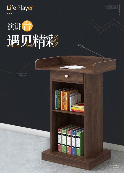 The reception desk hosts the emcee platform, the podium, the small ...