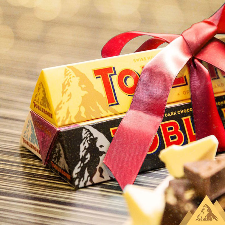 Toblerone Swiss triangle milk raisin/dark chocolate contains honey and ...