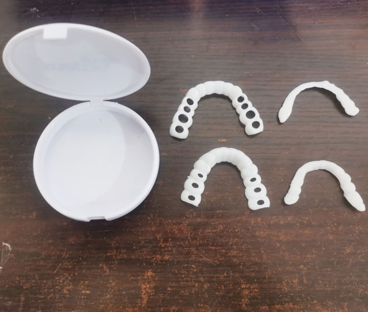 Upper and lower silicone simulated white dentures, snap on small ...