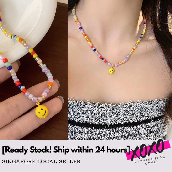 Ali Wong colorful beaded necklace layered with a silver heart necklace ...