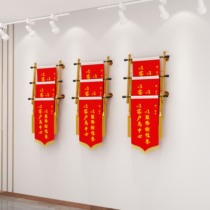 Multi-layer racks are hung on the wall of the banner display rack ...