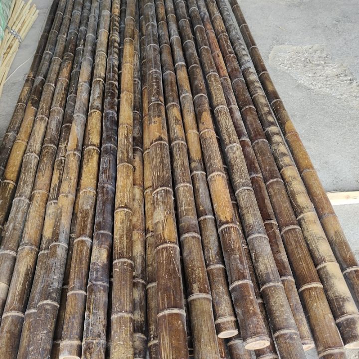 Indoor and outdoor partitions of carbonized bamboo poles are decorated ...