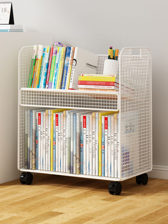 Small bookcase beside desk floor shelf movable wheeled desk simple book ...